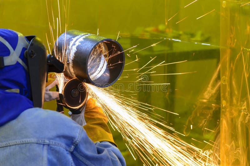 Worker Use Hand Grinder To Grinding the Square Metal Pipe. Stock Photo ...