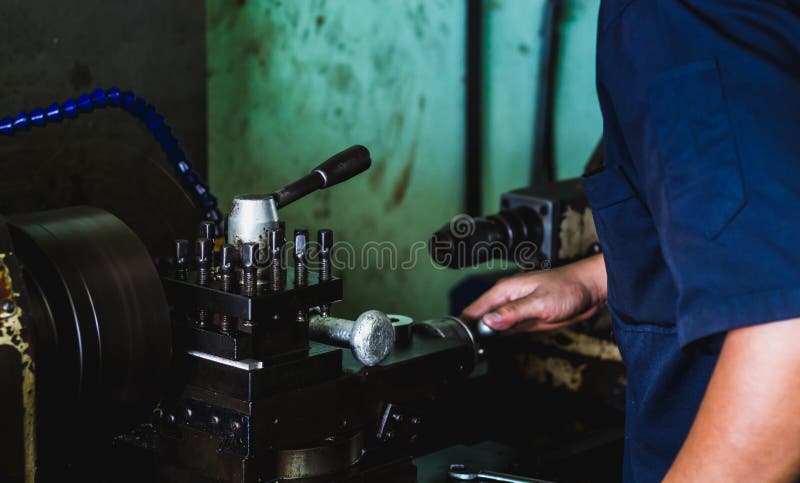 Worker Use Lathe Machine To Product in Workshop Stock Photo - Image of ...