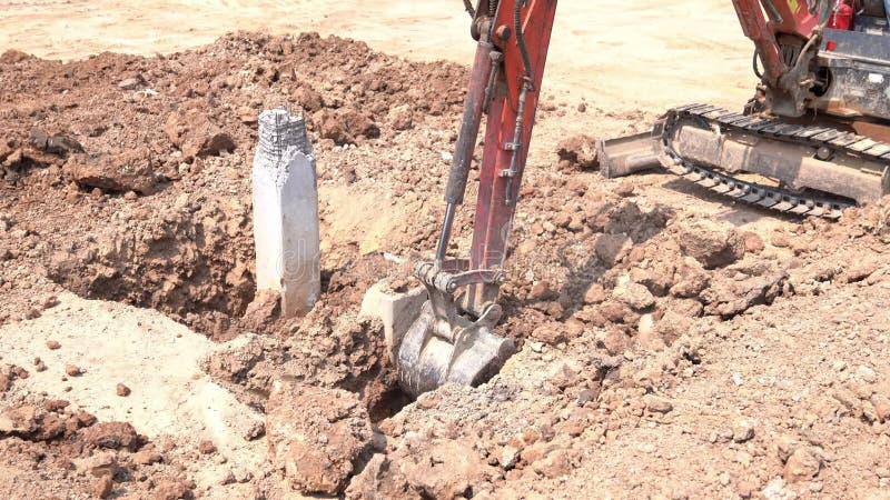 Worker Use Mini Excavator Dig Soil Around Foundation Pole Stock Video ...