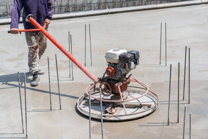 Worker Use Power Trowel Machine on Wet Concrete Stock Image - Image of ...