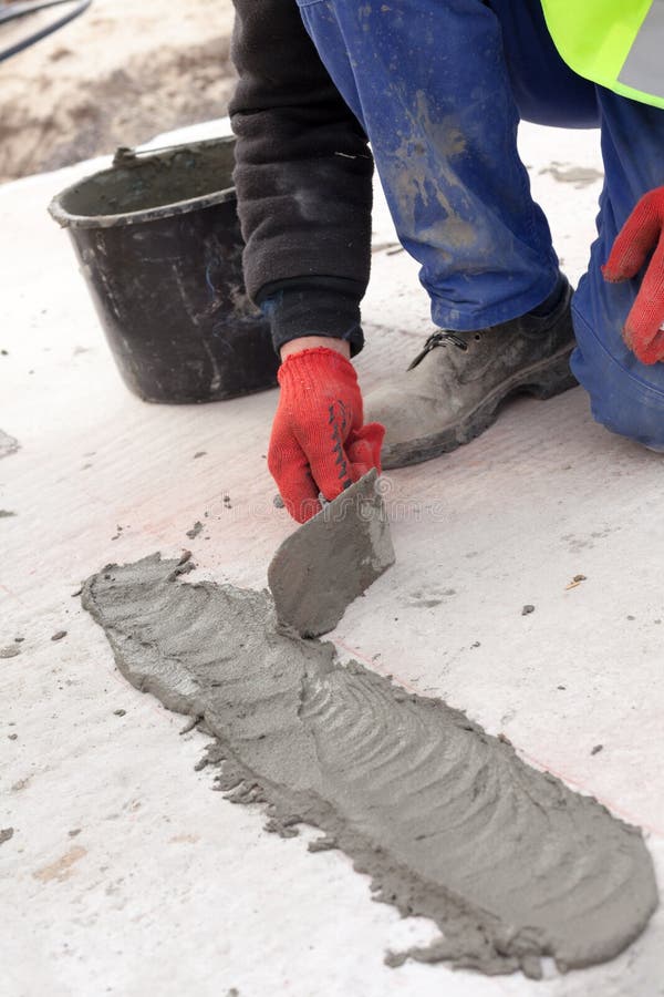 Worker Use Spatula for Plastering a Floor. Stock Image - Image of messy ...