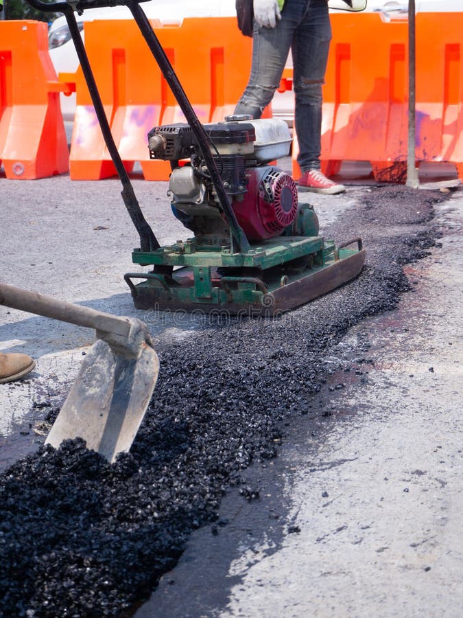 Worker Use Vibratory Plate Compactor Compacting Asphalt at Road Stock ...