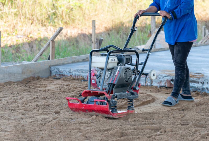 Worker in Use Vibratory Plate Compactor for Compaction Sand Stock Photo ...
