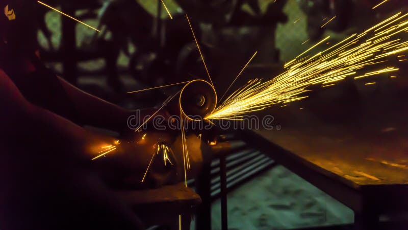 The Worker Uses Cutting Machine To Cut Metal, Focus on Flash Light Line ...