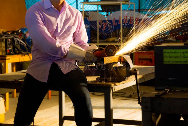The Worker Uses Cutting Machine To Cut Metal, Focus on Flash Light Line ...