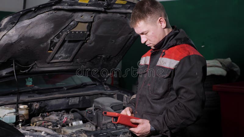 Worker Uses Digital Device To Check Automobile at Station Stock Video ...