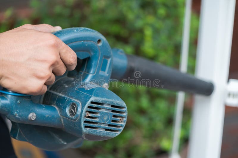 Worker Uses a Hand-held Blower To Remove Dust Stock Image - Image of ...