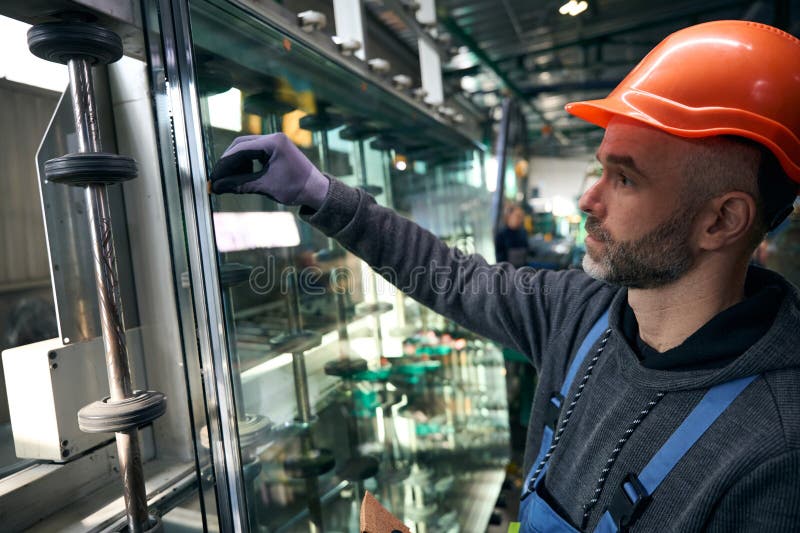 Worker Uses Special Tools To Work with Glass in Window Production Stock ...