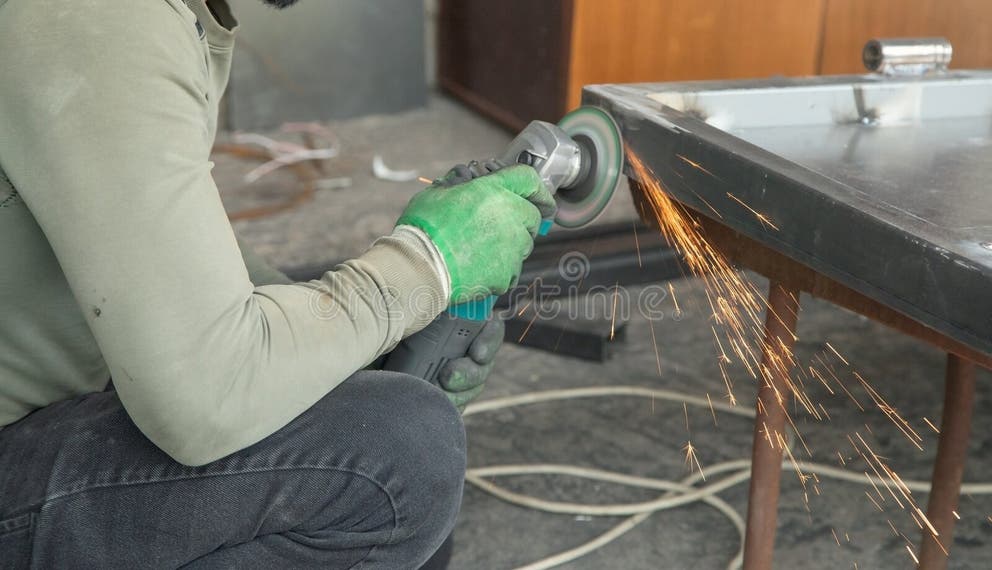 Worker Using Angle Grinder. Cutting Detail of Iron Gate Stock Image ...