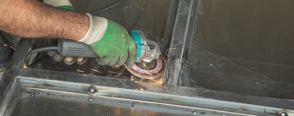 Worker Using Angle Grinder. Cutting Detail of Iron Gate Stock Photo ...