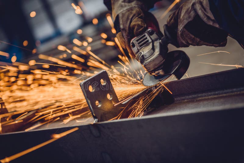 Worker Using Angle Grinder stock photo. Image of grinding - 89772356