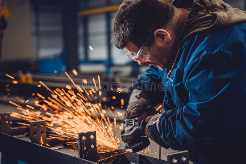 Worker Using Angle Grinder stock photo. Image of protection - 89772510