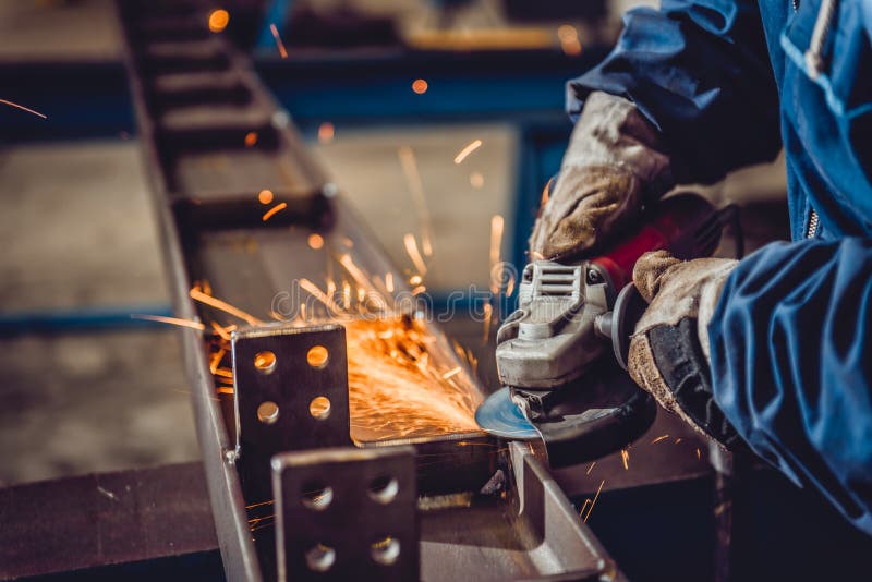 Worker Using Angle Grinder stock image. Image of construction - 89772947