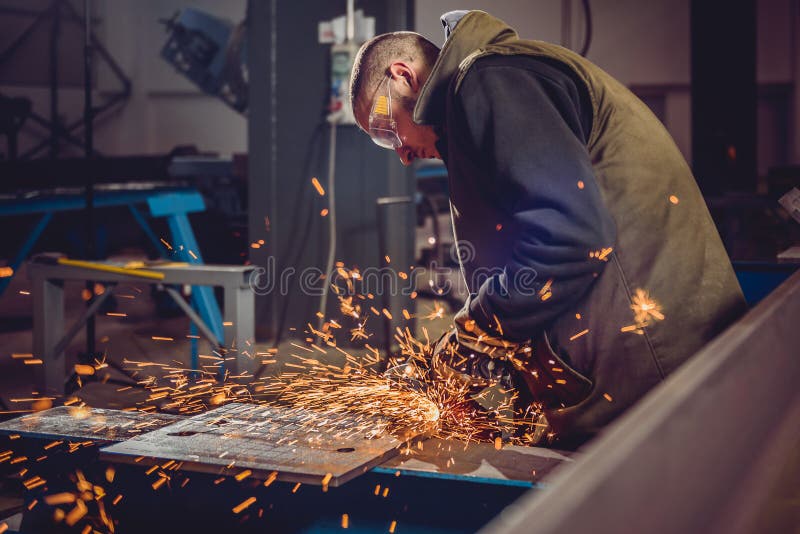 Worker Using Angle Grinder stock image. Image of commercial - 89773761