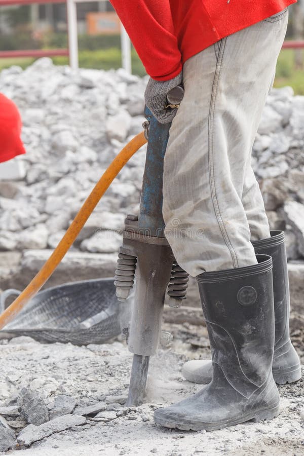 Worker Using Construction Drilling Cement on the Ground Stock Image ...