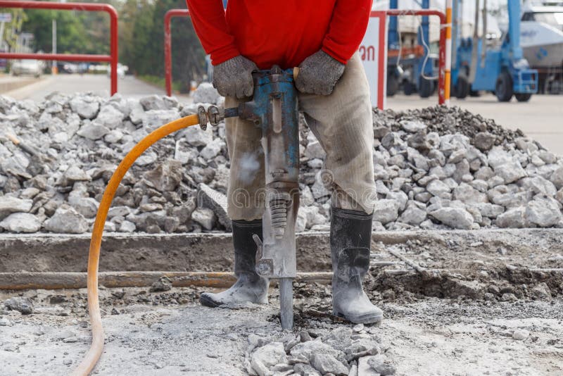 Worker Using Construction Drilling Cement on the Ground Stock Image ...