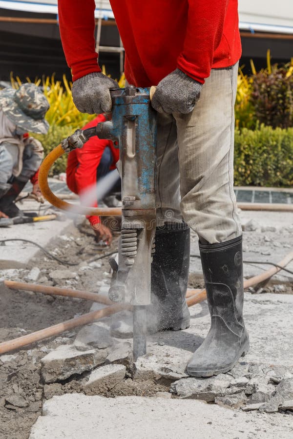 Worker Using Construction Drilling Cement on the Ground Stock Image ...