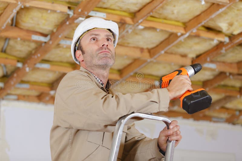 Worker Using Cordless Drill Stock Photo - Image of impact, drill: 266082278