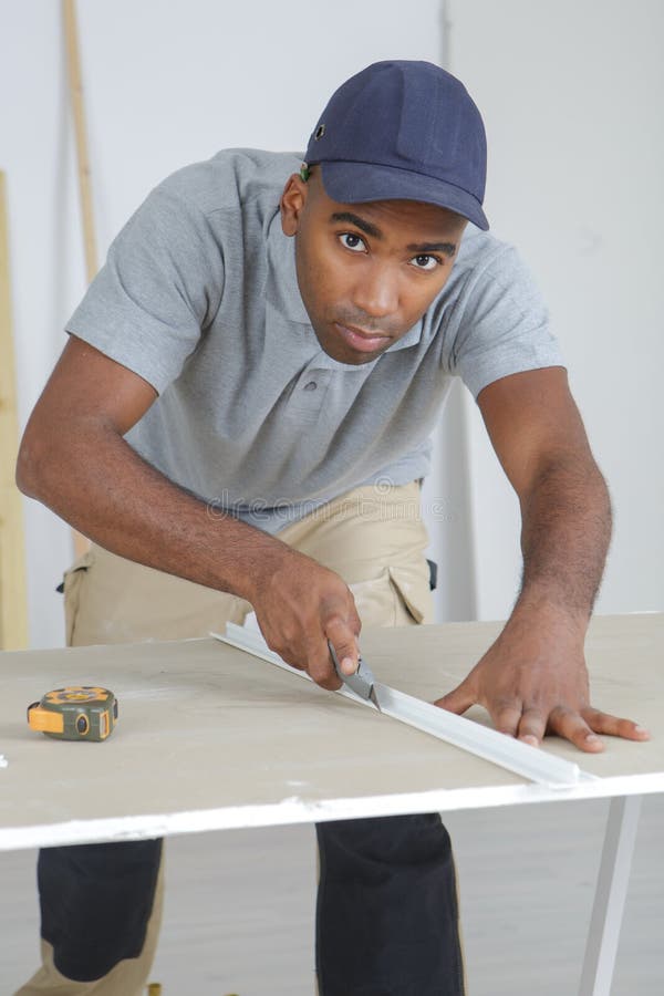 Worker using a cutter stock photo. Image of sharp, blade - 132199432