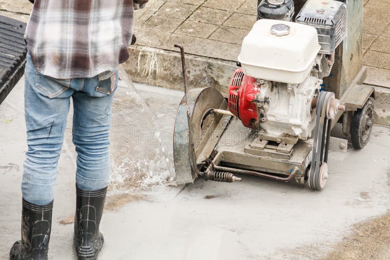 Worker Using Diamond Saw Blade Machine Cutting Concrete Road at ...