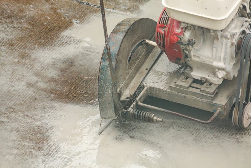 Worker Using Diamond Saw Blade Machine Cutting Concrete Road at ...
