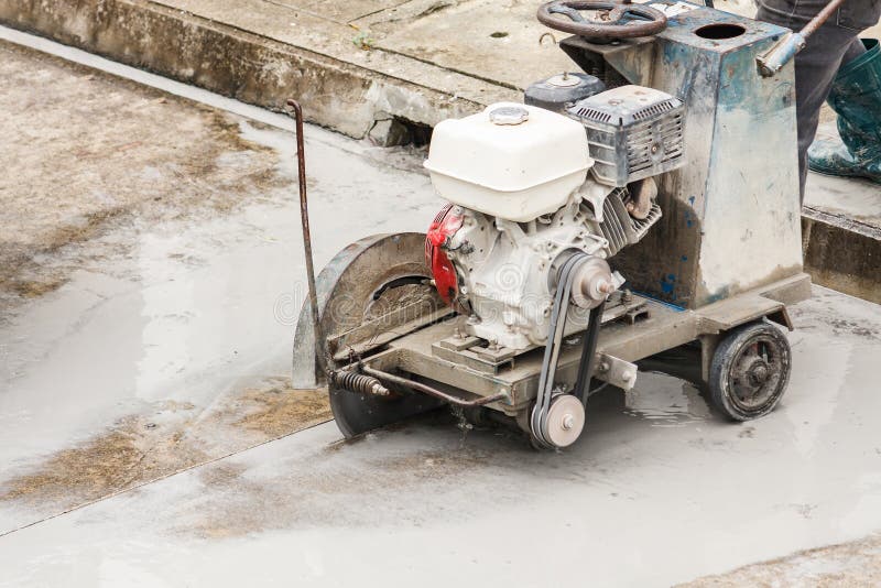 Worker Using Diamond Saw Blade Machine Cutting Concrete Road at ...