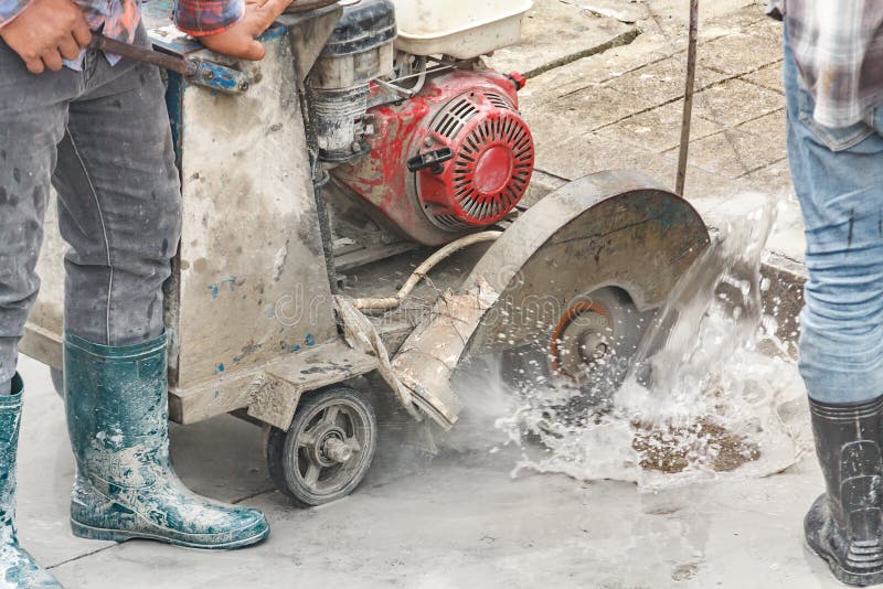 Worker Using Diamond Saw Blade Machine Cutting Concrete Road at ...