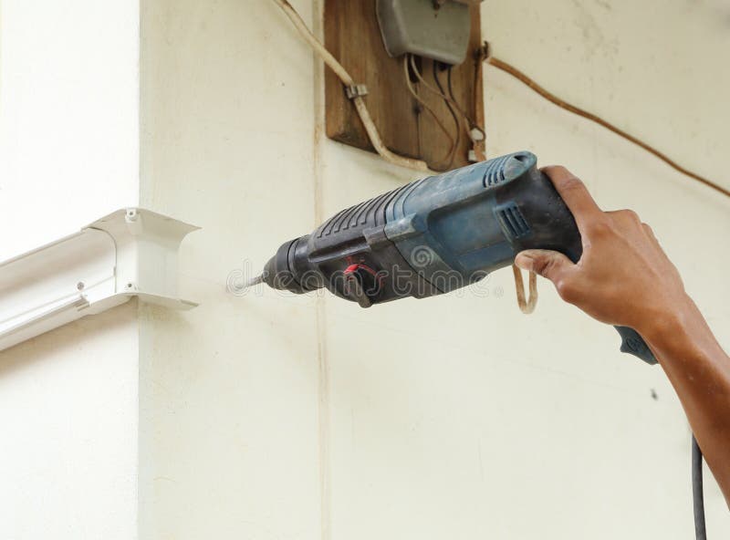 Worker using drill stock image. Image of drill, equipment - 43451663