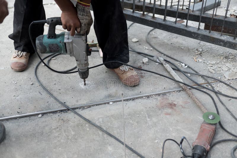 Worker Using Electric Drill Ground Drilling by Machine Tool Stock Image ...