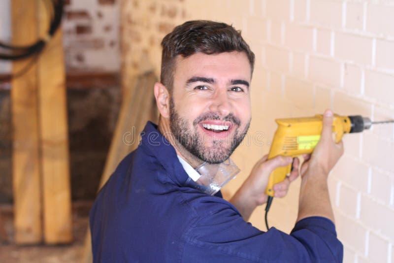 Worker Using Electric Drill on Wall Stock Image - Image of male, drill ...