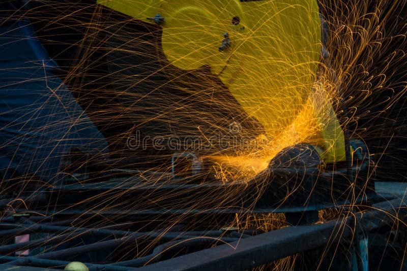 Worker Using Electric Grinder Machine Cutting Steel. Steel Cutting ...