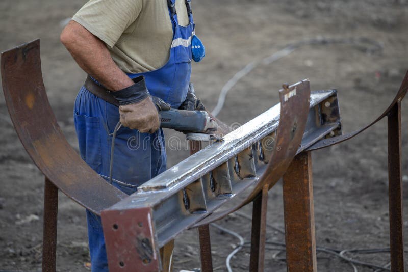 Worker Using Grinder To Clean Rust from Metal Stock Photo - Image of ...
