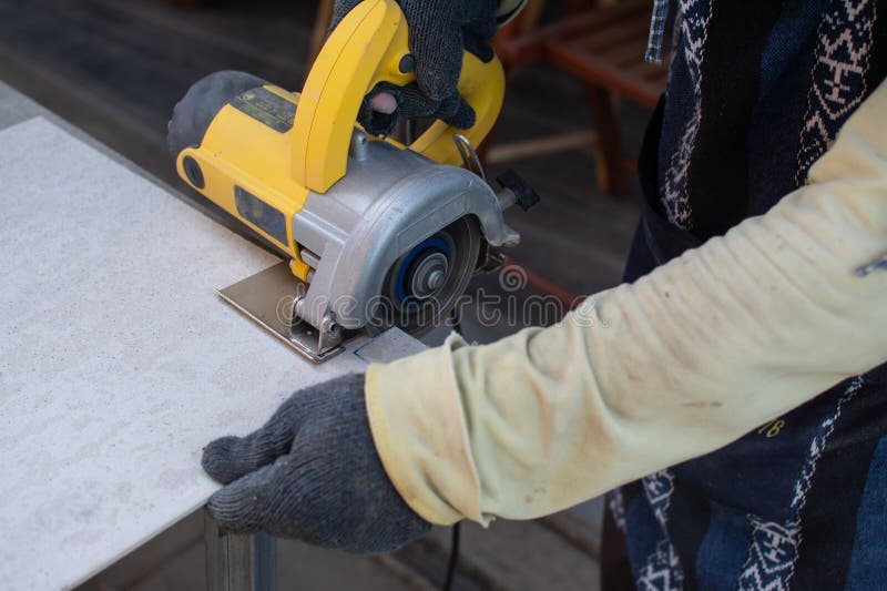Worker Using a Grinding Machine for Cut Cement Board Stock Photo ...
