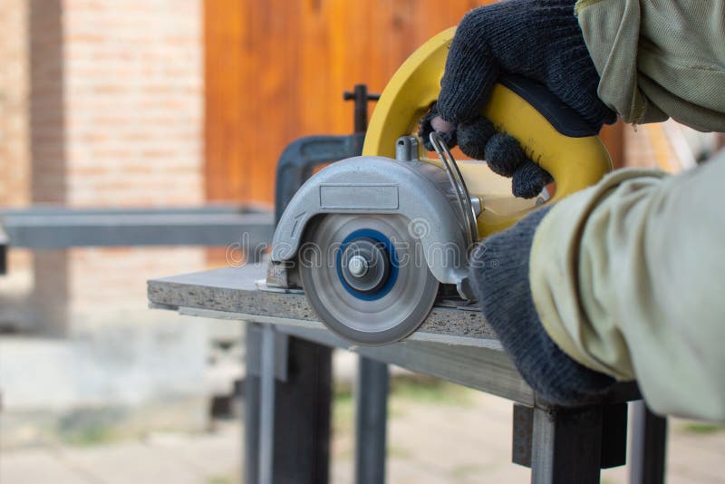 Worker Using a Grinding Machine for Cut Cement Board Stock Photo ...