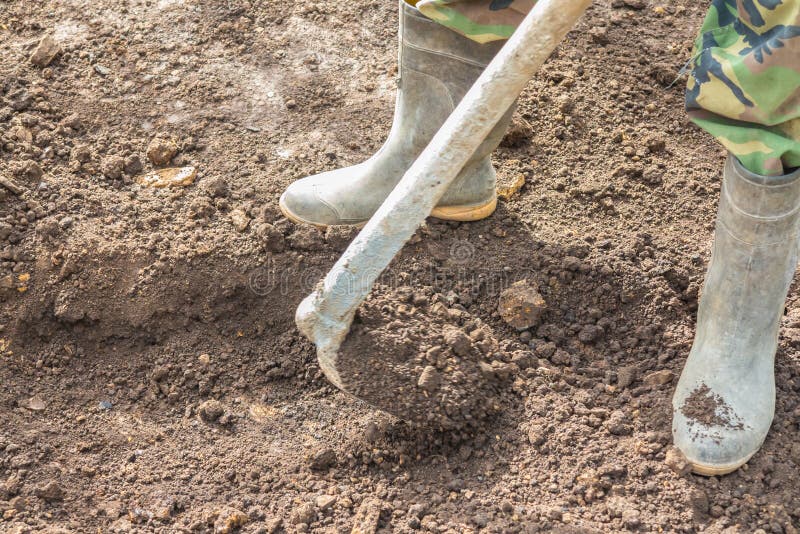 Worker Using Hoe Dig the Soil. Stock Image - Image of blur, ground ...