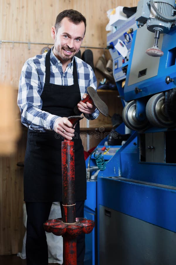 Worker Using Instruments in Boots Repair Workshop Stock Photo - Image ...