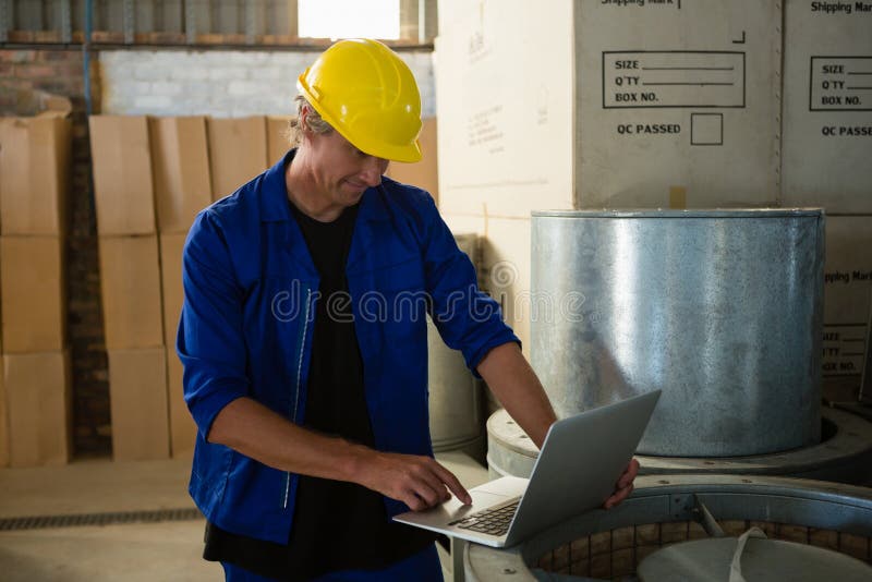 Worker Using Laptop in Olives Factory Stock Photo - Image of computer ...