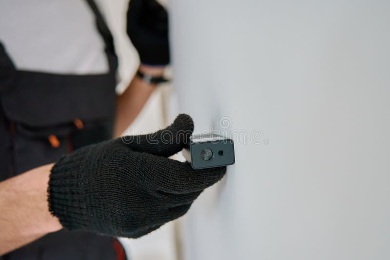 Worker Using Laser Distance Measurer on Wall Stock Image - Image of ...