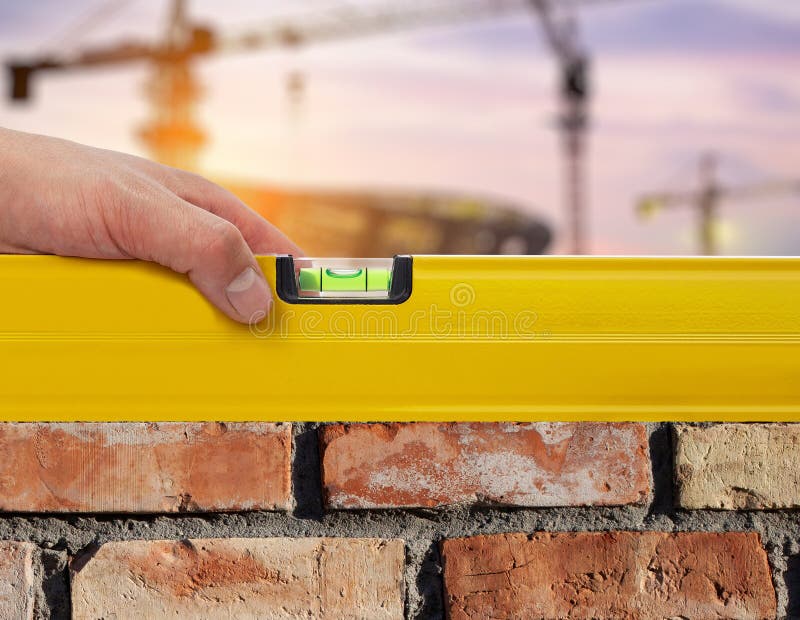 Worker Using Level on Building Site - Concept. Stock Image - Image of ...