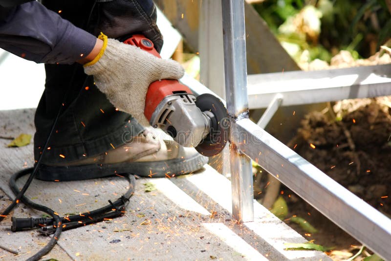 Worker Using Metal Polish Machine Grinding Weld on Steel Work Stock ...