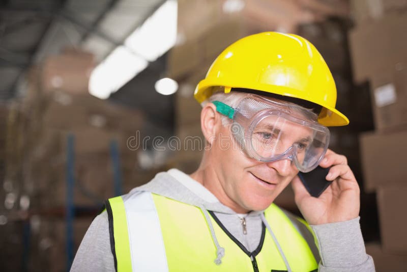 Worker Using Mobile Phone in Warehouse Stock Photo - Image of front ...