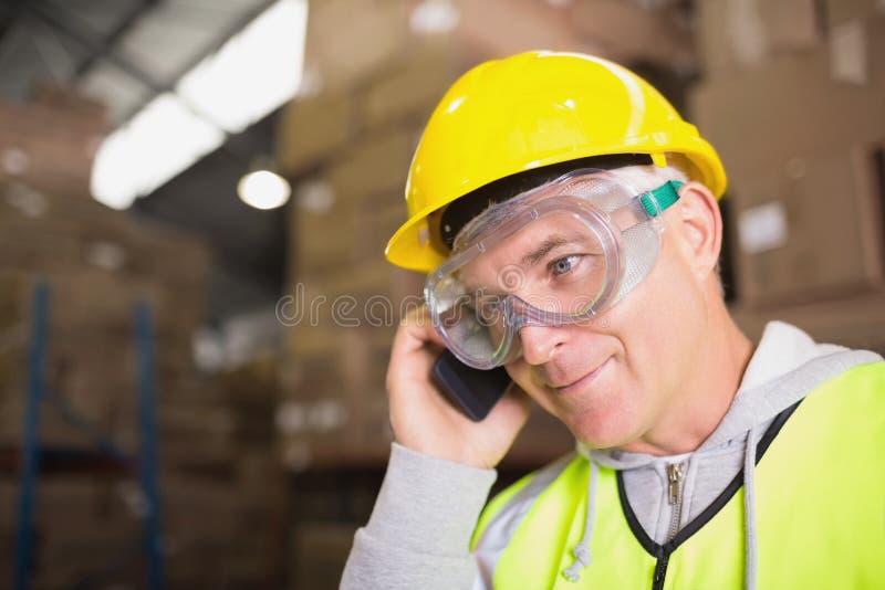 Worker Using Mobile Phone in Warehouse Stock Photo - Image of cardboard ...
