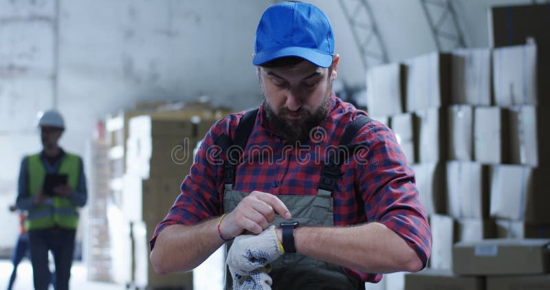 Worker Using Phone in a Warehouse Stock Image - Image of inside ...
