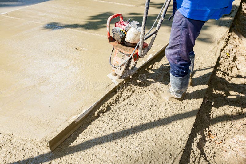 Worker is Using Power Tool with Engine, Compactor, for Level and ...