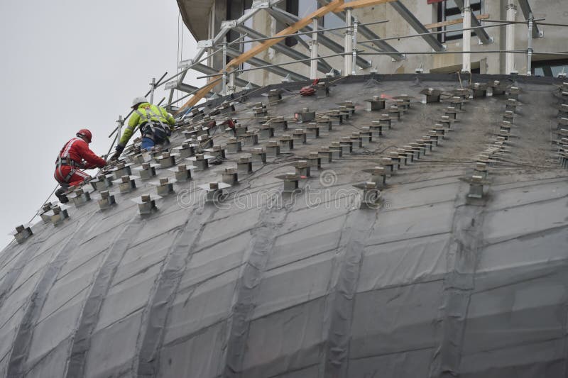 Worker Using Safety Strap on the Roof of a Bulding Under Constru Stock ...