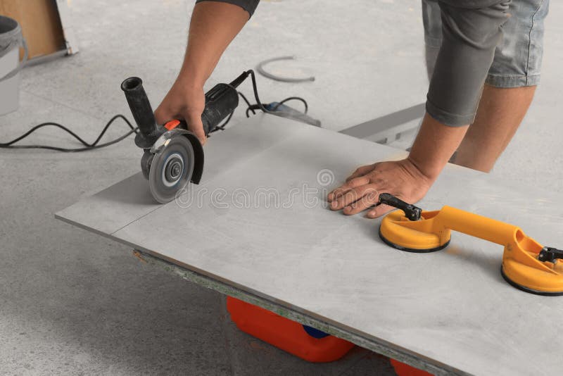 Worker Using Saw with Circular Diamond Blade for Tile Cutting Indoors ...