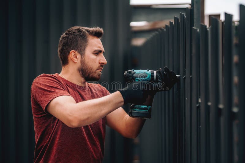 Worker Using Screwdriver for Fastening and Drilling Screws Stock Image ...