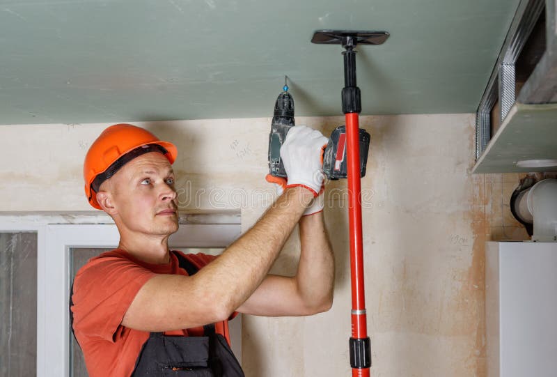 Plasterboard Installation on the Ceiling Stock Photo - Image of holds ...