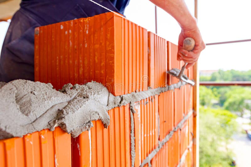 Builder Using Spatula To Remove Surplus Mortar Stock Image - Image of ...