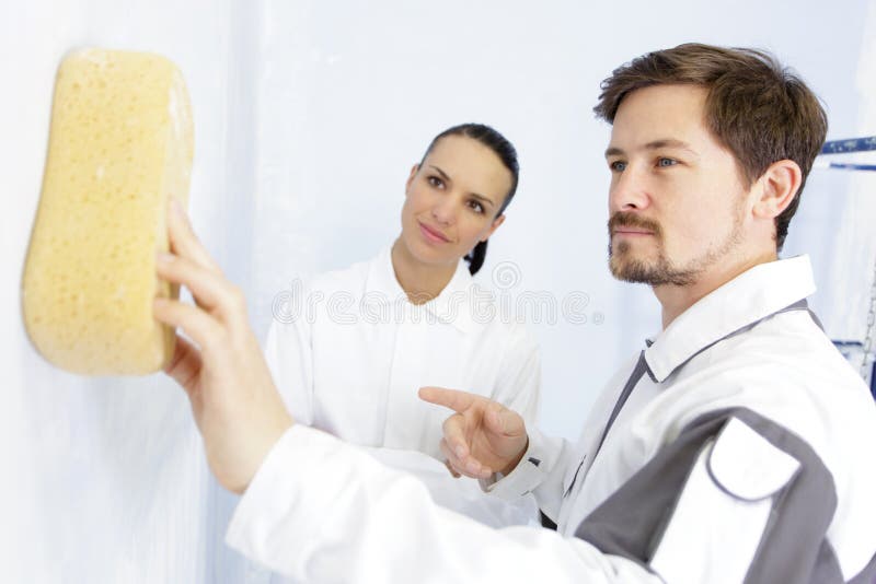 Worker using sponge stock photo. Image of ceramic, professional - 250316442